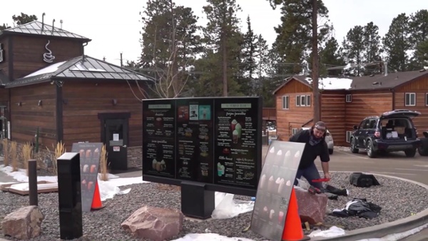 Drive thru menu with built-in speaker